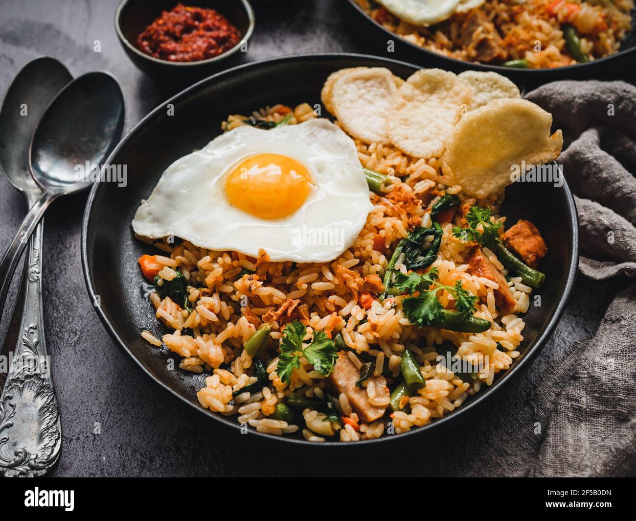 Indonesian Fried Rice Nasi Goreng served with soya sauce, chilli paste ...