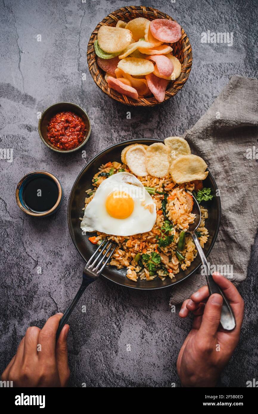 Indonesian Fried Rice Nasi Goreng served with soya sauce, chilli paste ...