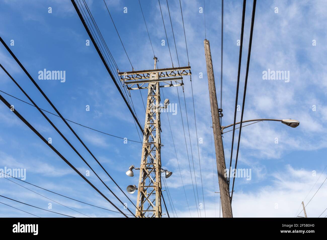 View looking up of metal and wood power structures with electrical ...