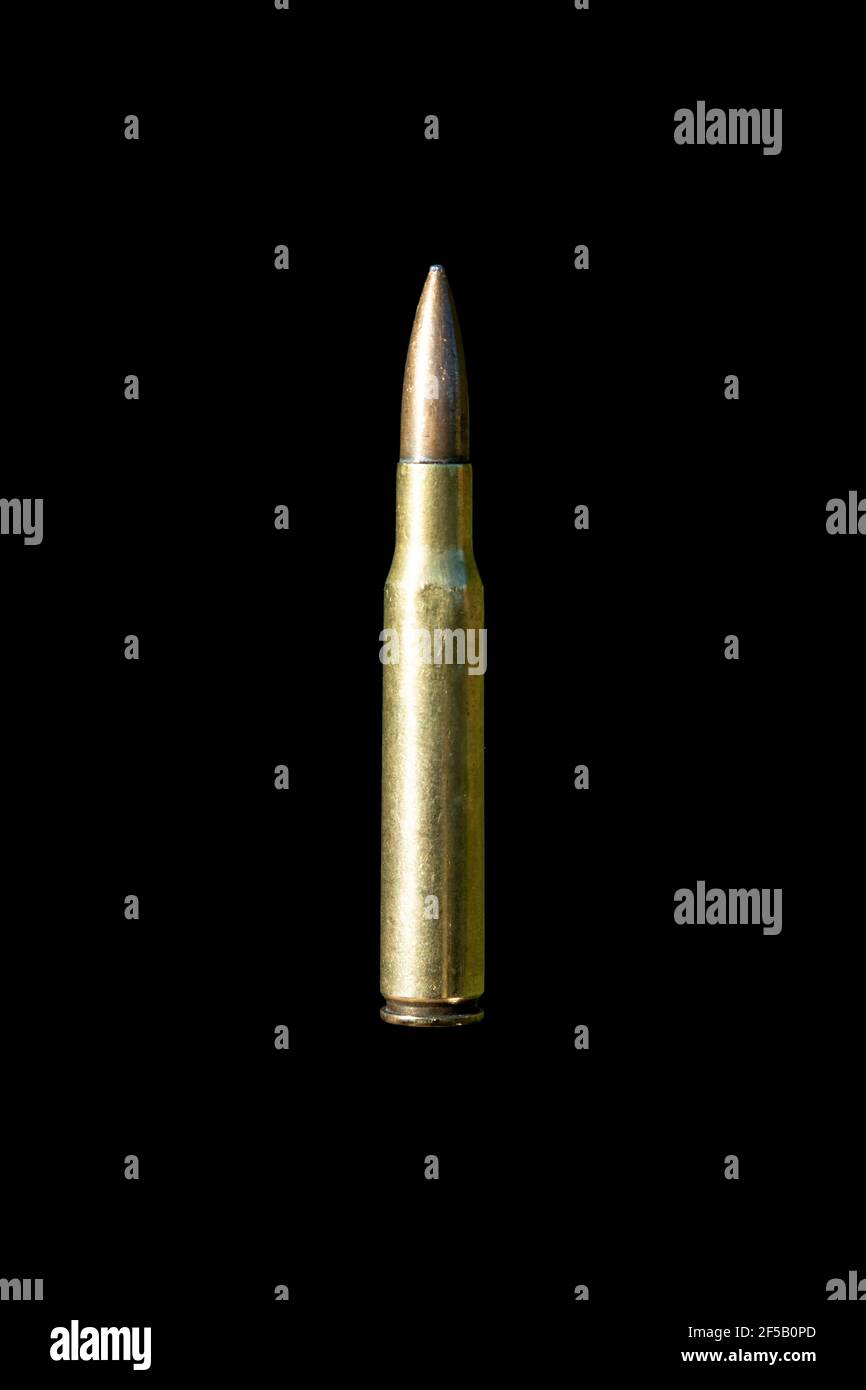 Rifle bullet long cartridge on black background Stock Photo - Alamy