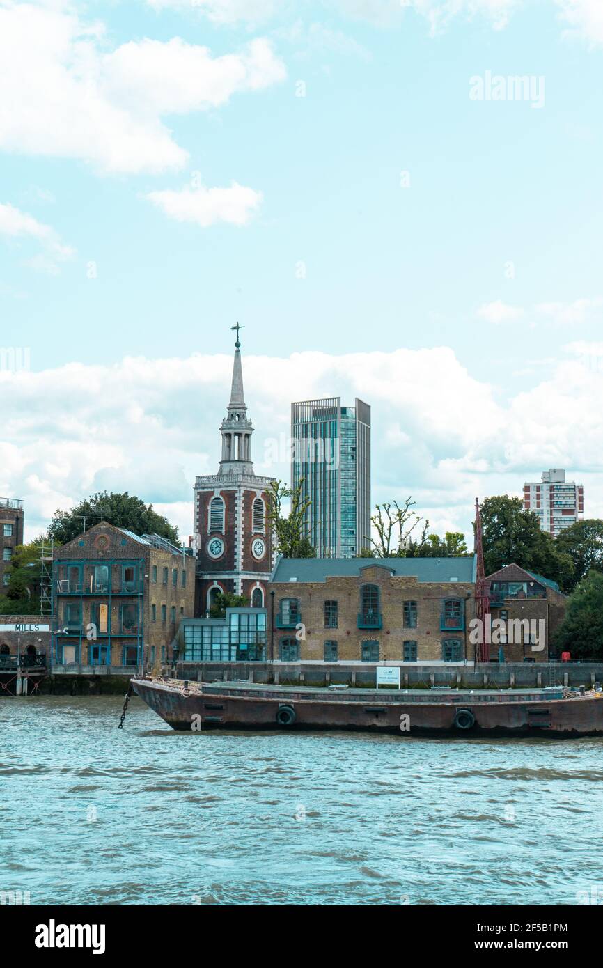 Vertical shot of the sailboat docked on the pier in Southwark, London ...
