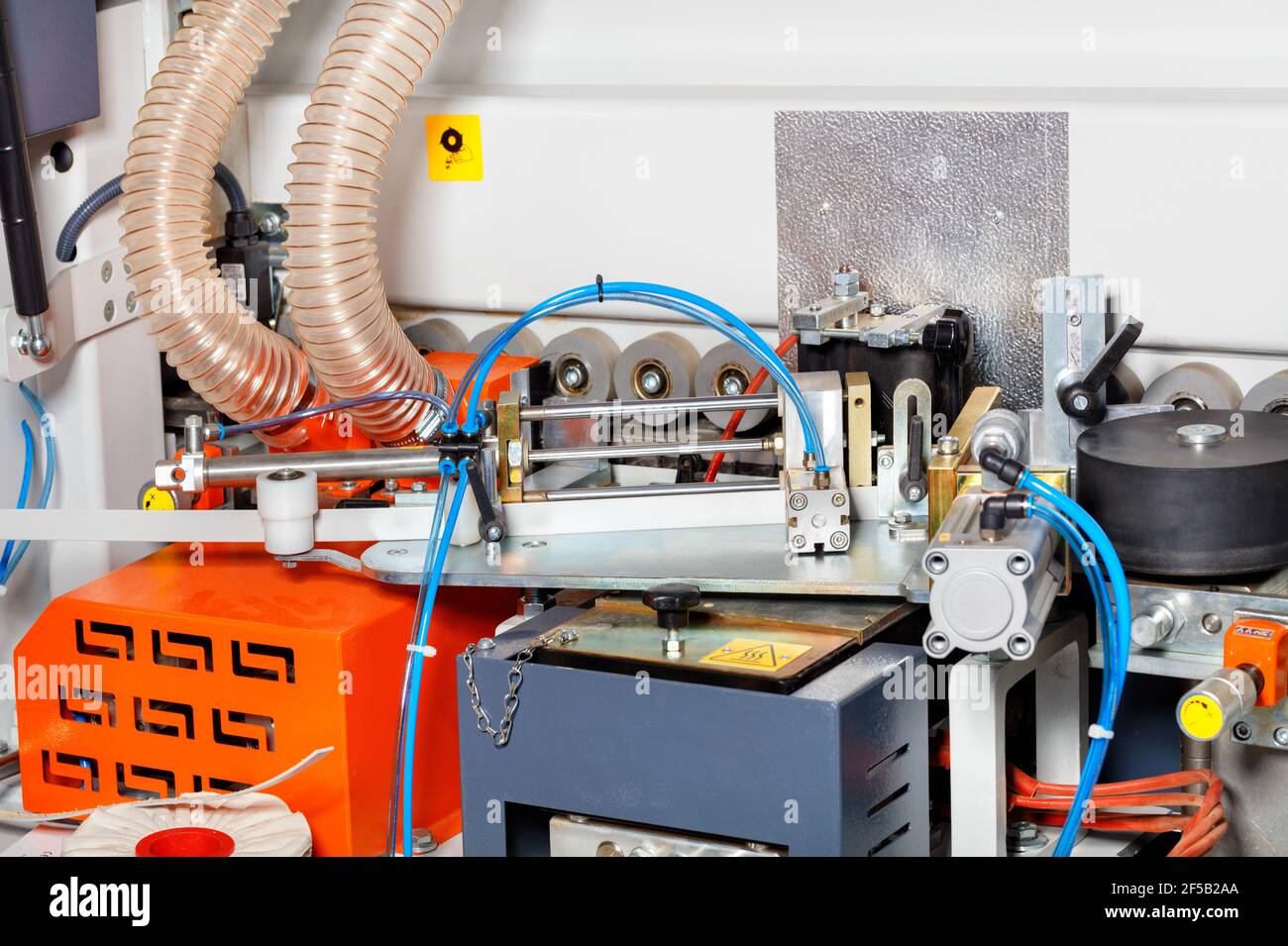 Rear end of modern woodworking machine with motors, pressure rollers ...