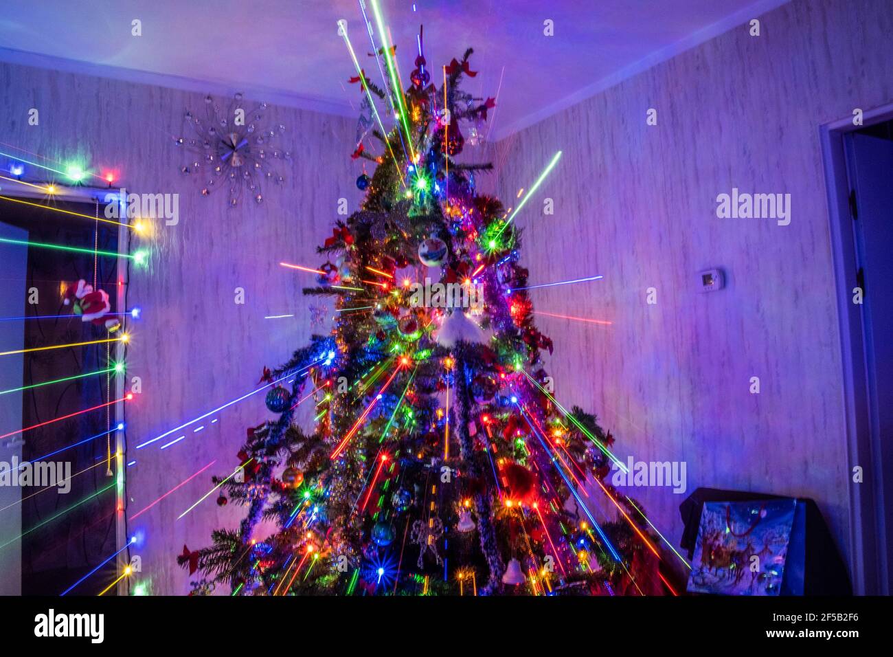 Decorated Christmas tree on blurred background Stock Photo - Alamy