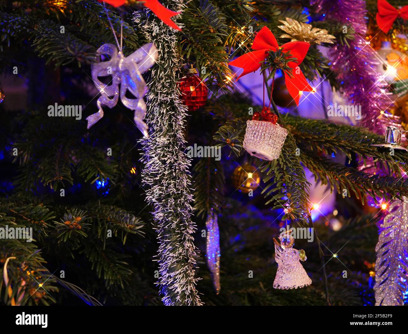 Decorated Christmas tree on blurred background Stock Photo - Alamy