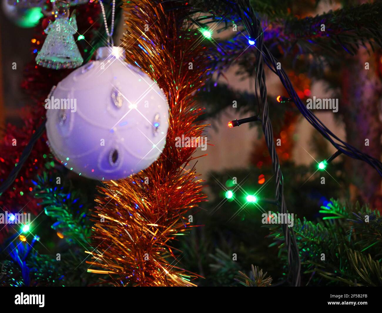 Decorated Christmas tree on blurred background Stock Photo - Alamy