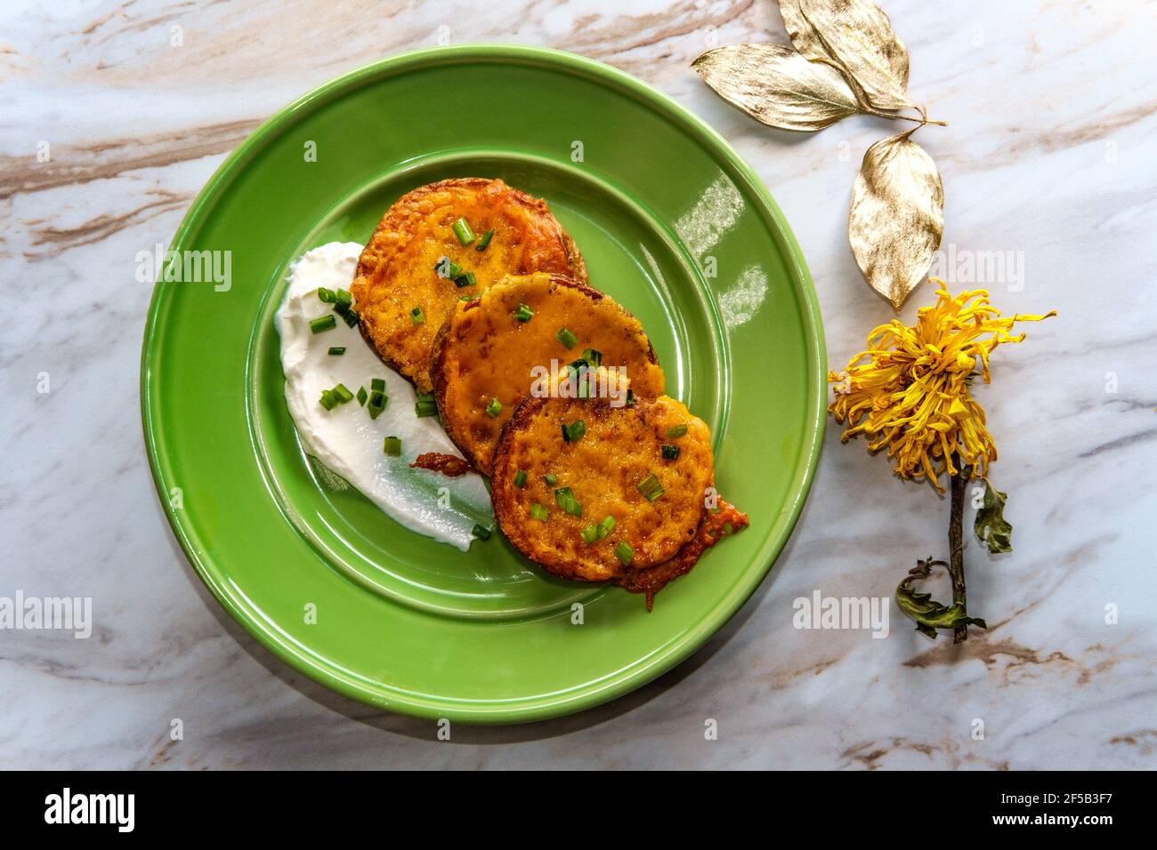 Cheesy oven roasted cheddar potato rounds with sour cream and chive ...