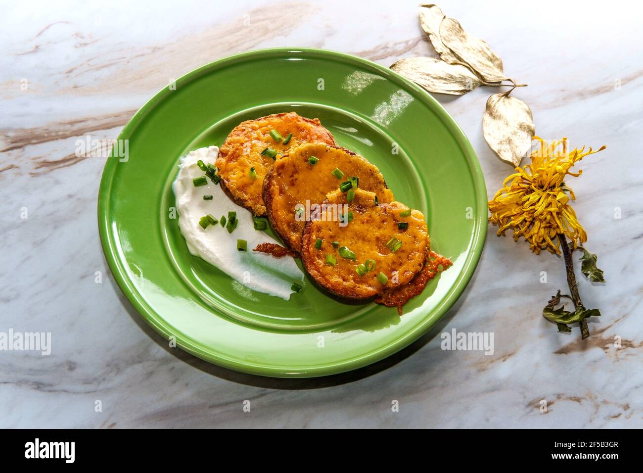 Cheesy oven roasted cheddar potato rounds with sour cream and chive ...