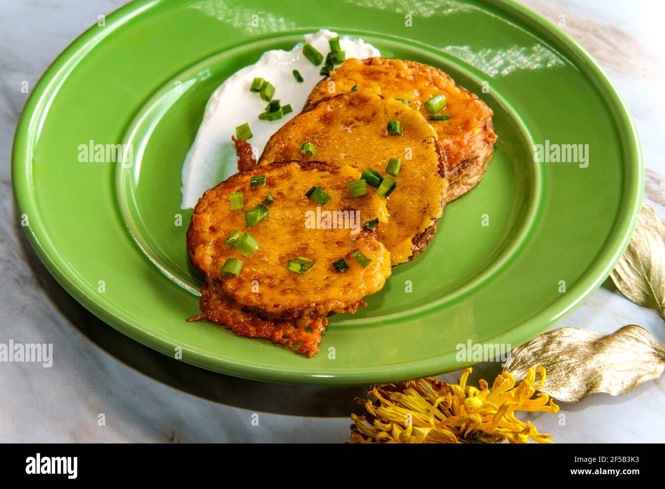 Cheesy oven roasted cheddar potato rounds with sour cream and chive ...