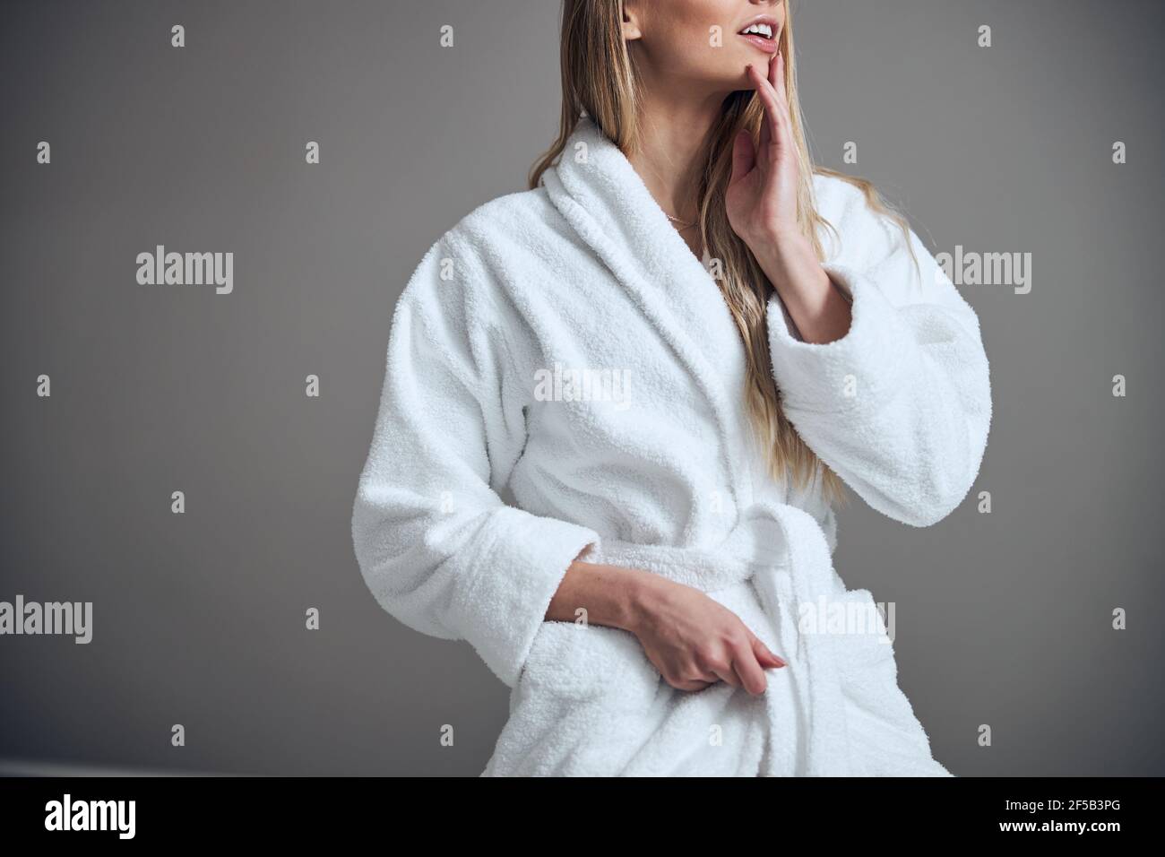 Slim spa client standing in a beauty salon Stock Photo - Alamy