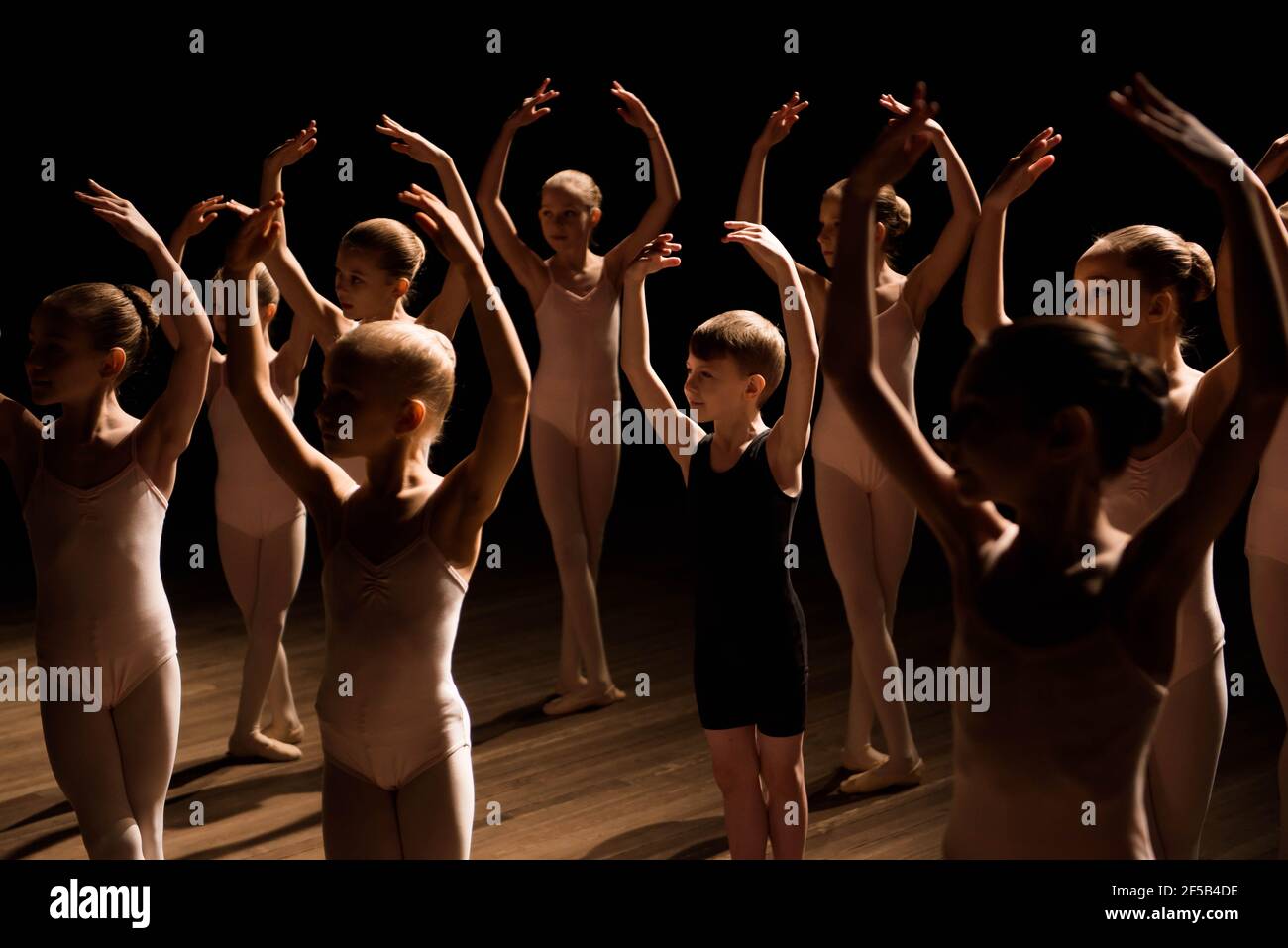 A large group of children rehearsing and dancing the ballet Stock Photo ...