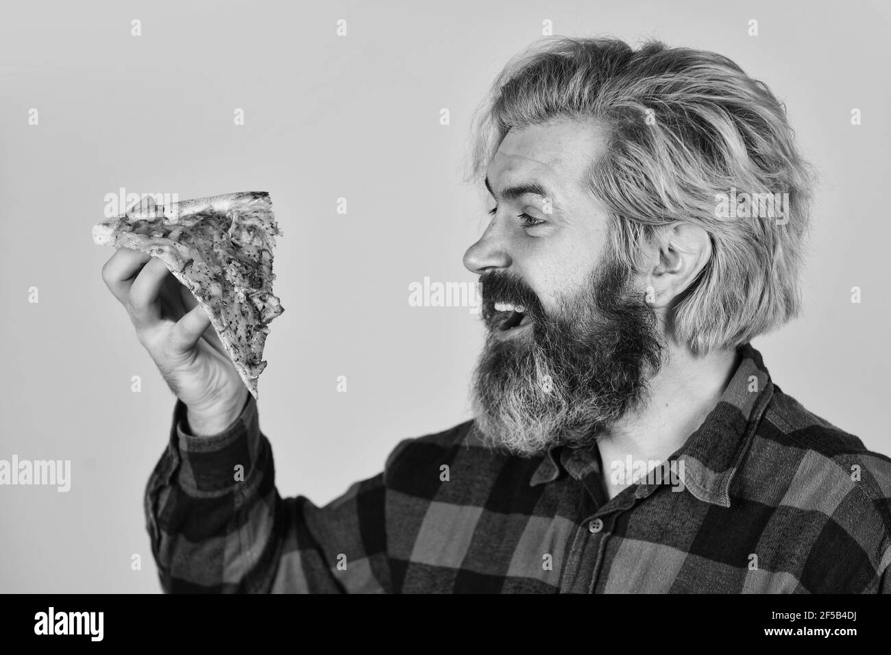 bearded male chef cook or baker man. Hold italian pizza slice. man from ...