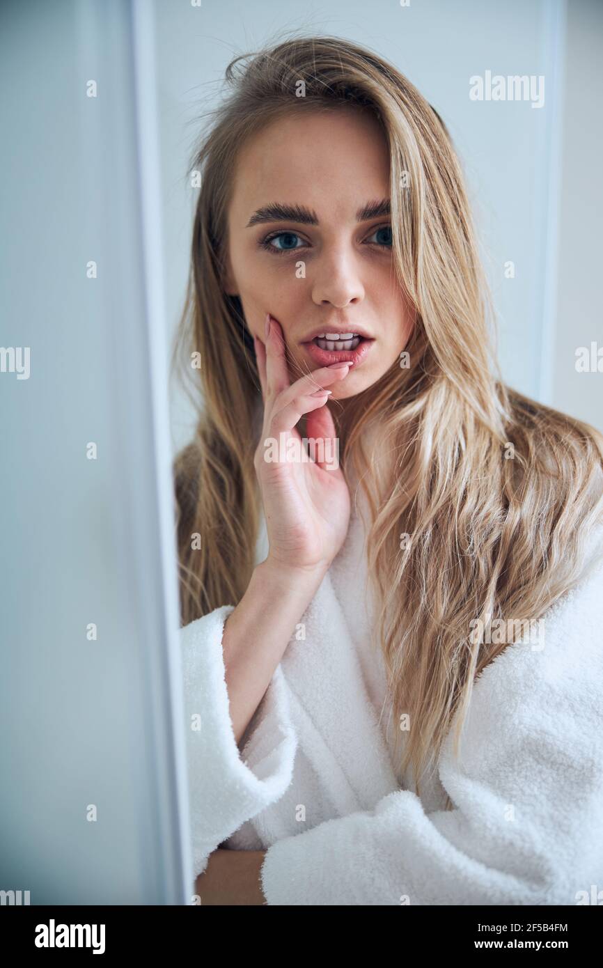 Relaxed young female staring in front of her Stock Photo - Alamy