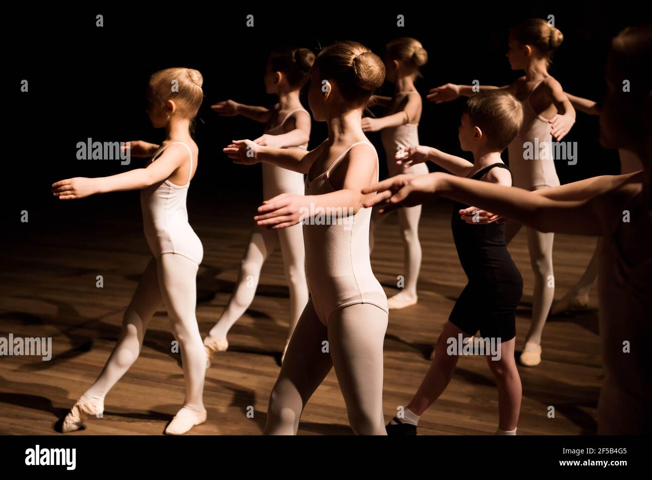 A large group of children rehearsing and dancing the ballet Stock Photo ...