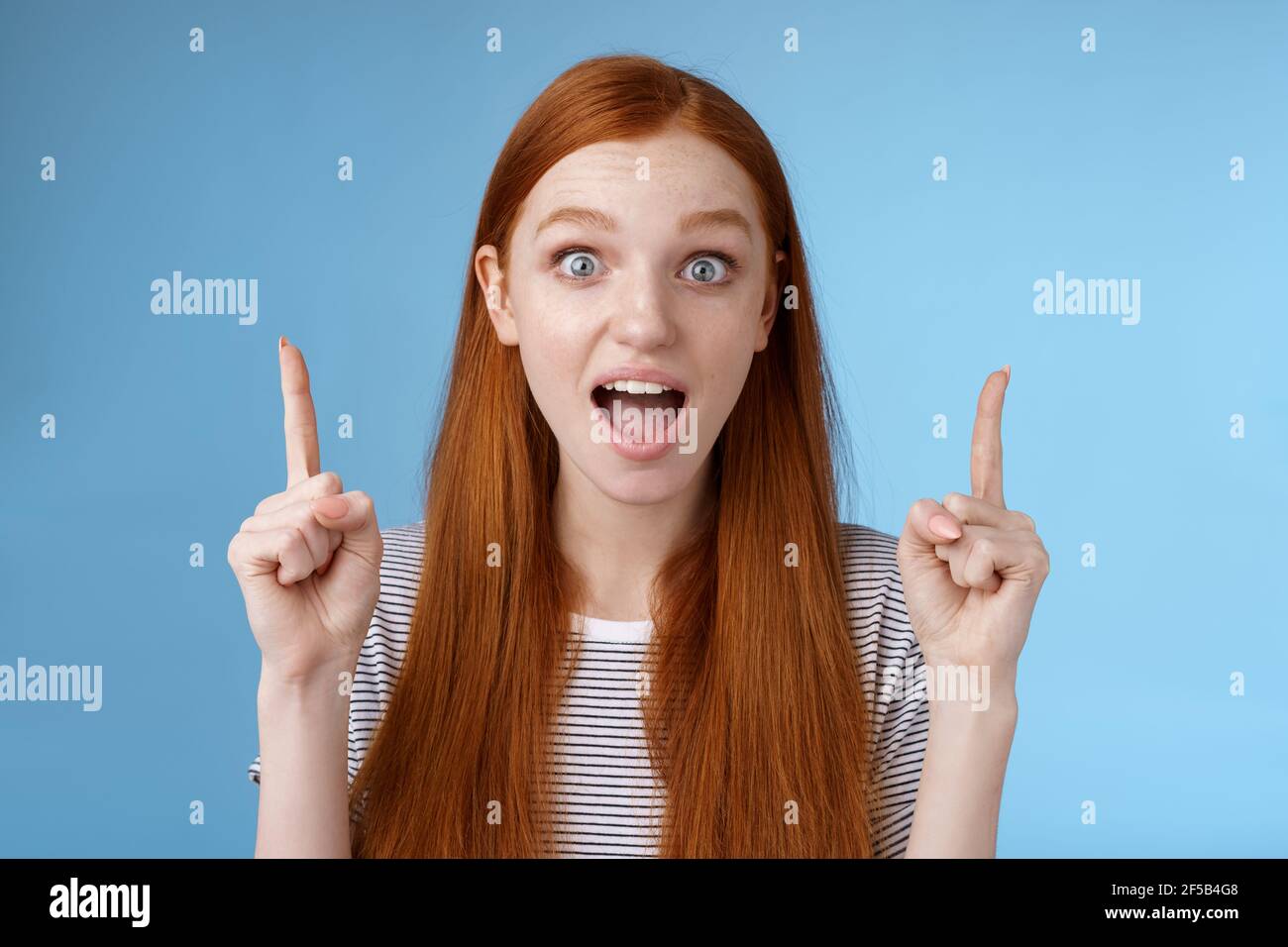 Surprised Happy Enthusiastic Young Redhead Woman Reacting Impressed