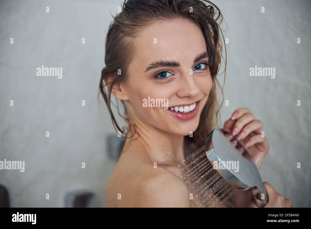 Happy pretty lady having a shower at home Stock Photo - Alamy