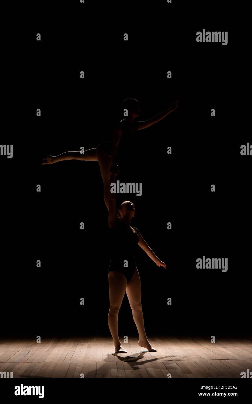Acrobatic dance. Dance with elements of acrobatics. Girls doing dance ...