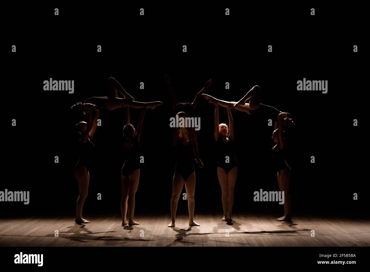 Acrobatic dance. Dance with elements of acrobatics. Girls doing dance ...