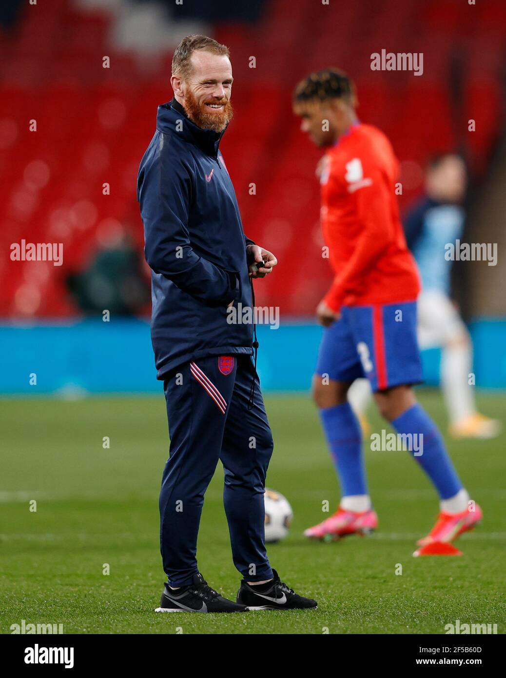 England sports science expert Bryce Kavanagh watches warm up prior to ...