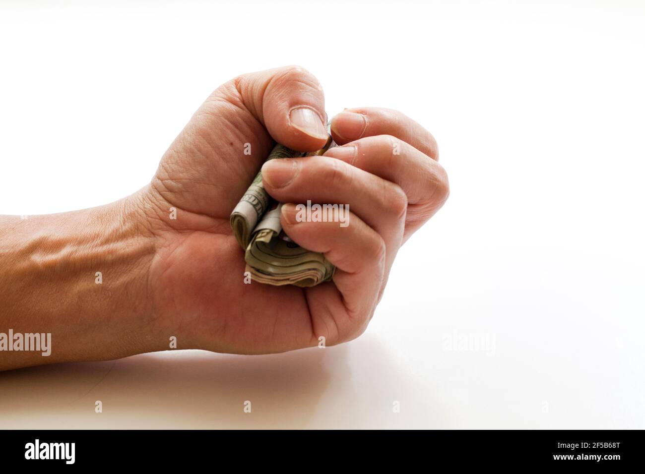 Clinching money hi-res stock photography and images - Alamy