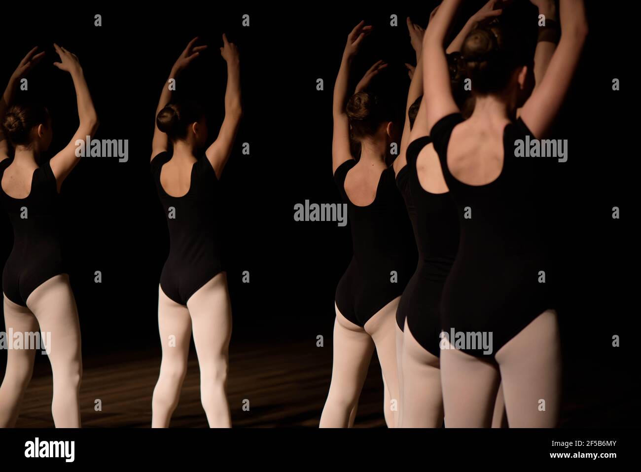 A choreographed dance of a group of graceful pretty young ballerinas ...