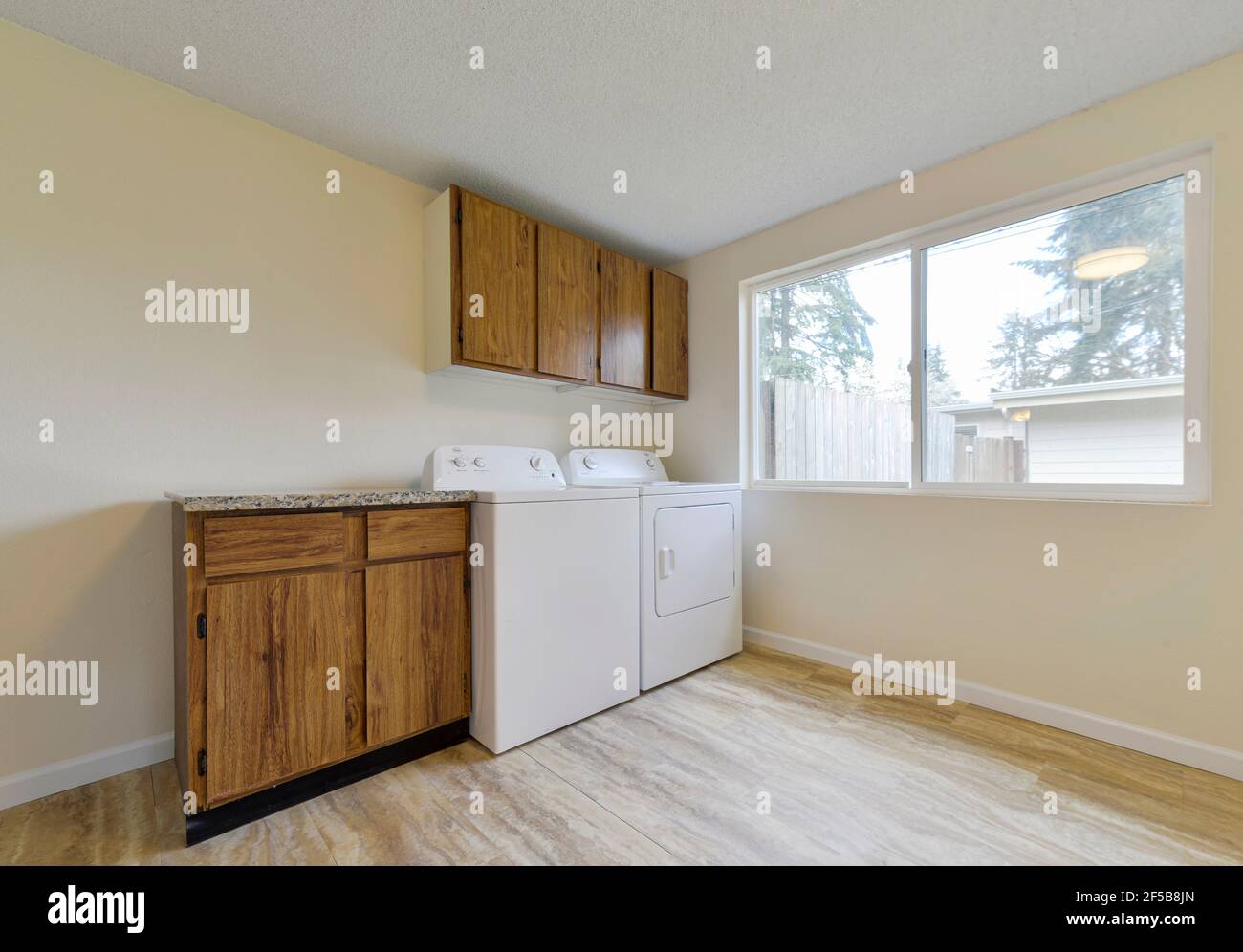 Modern residential laundry room interior Stock Photo - Alamy