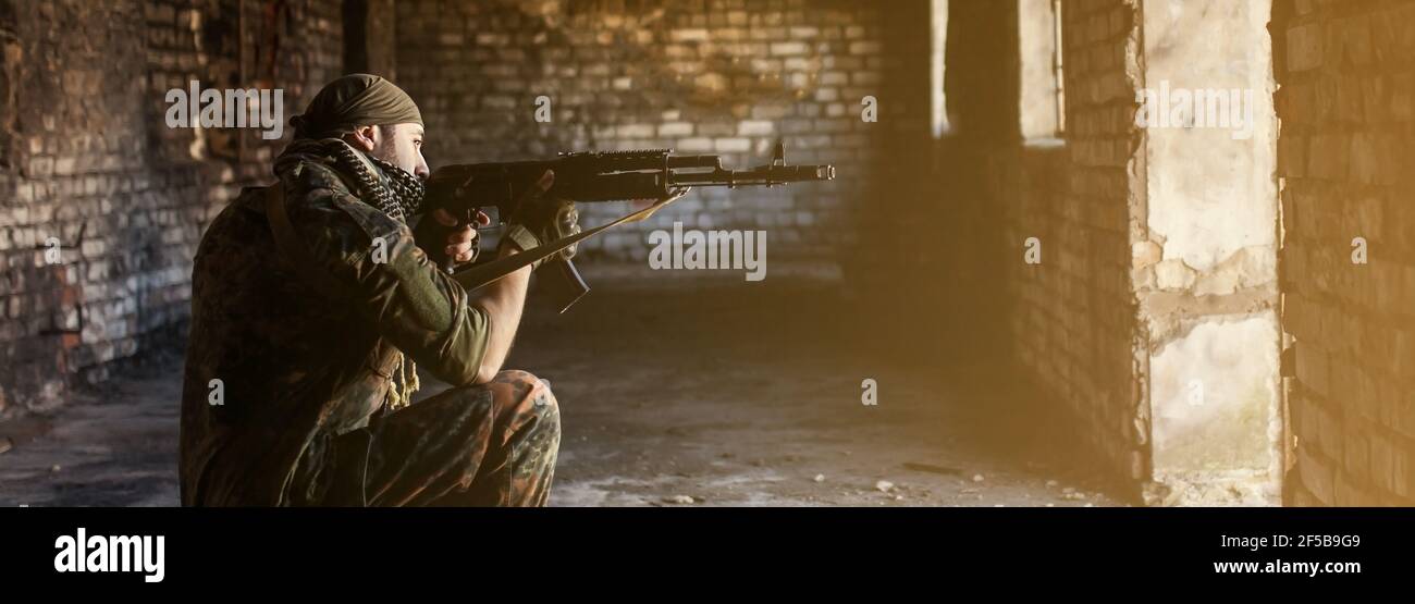 Arab soldier aiming with Kalashnikov AK-47 assault rifle Stock Photo ...