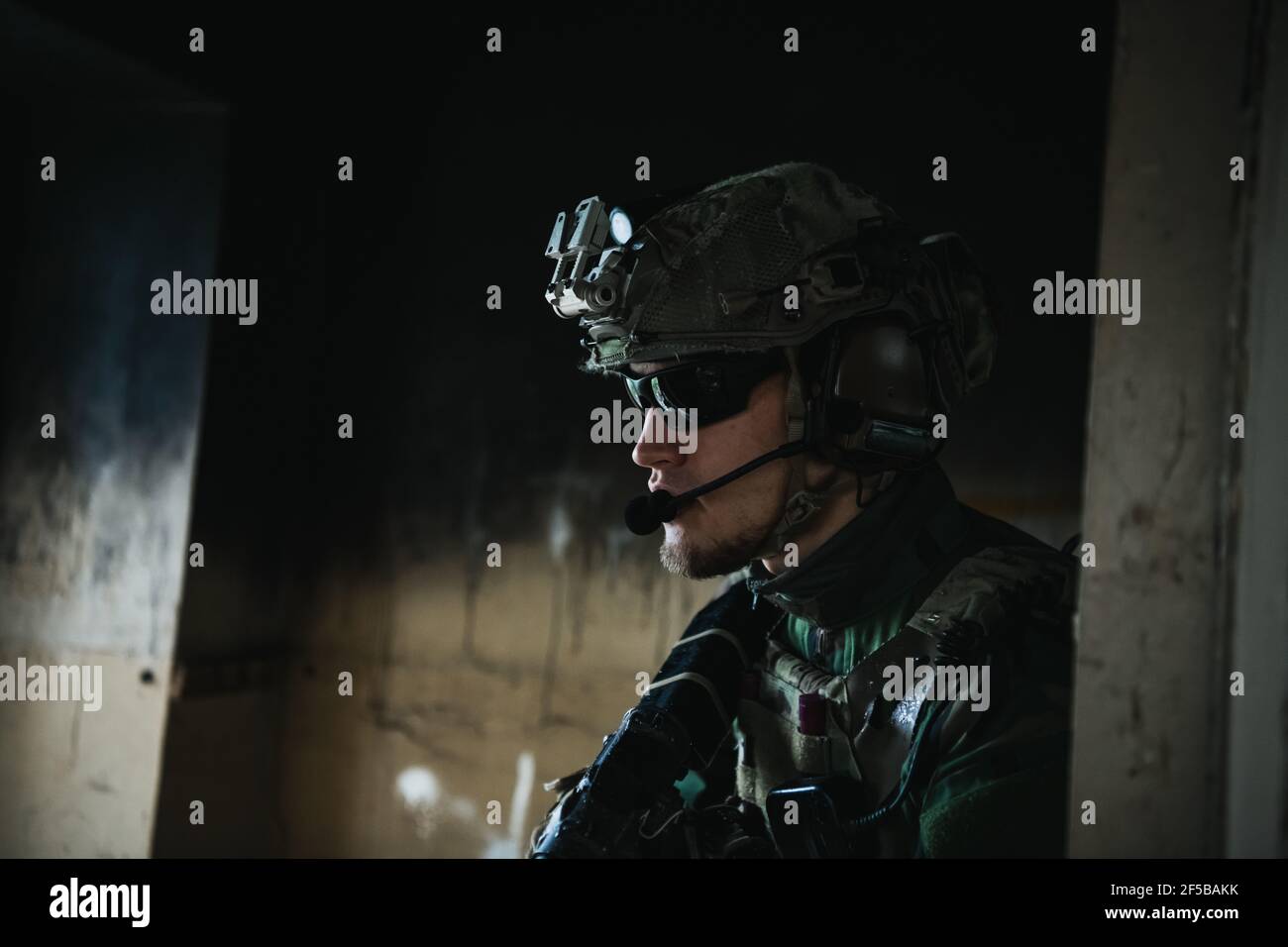 Soldier preparing tactical gear for action battle Stock Photo - Alamy