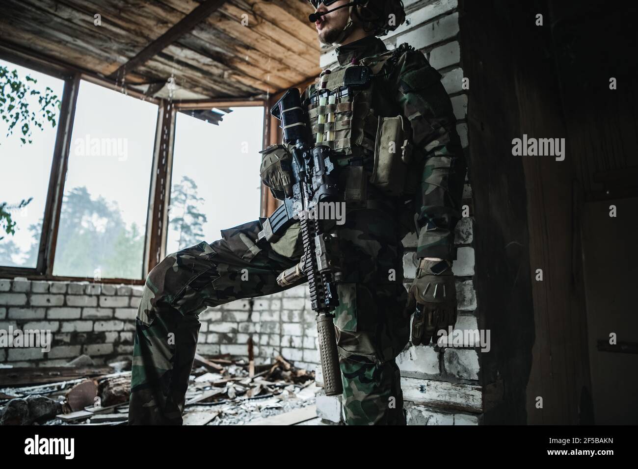 Front view close up of caucasian soldier with a rifle stand guard ...
