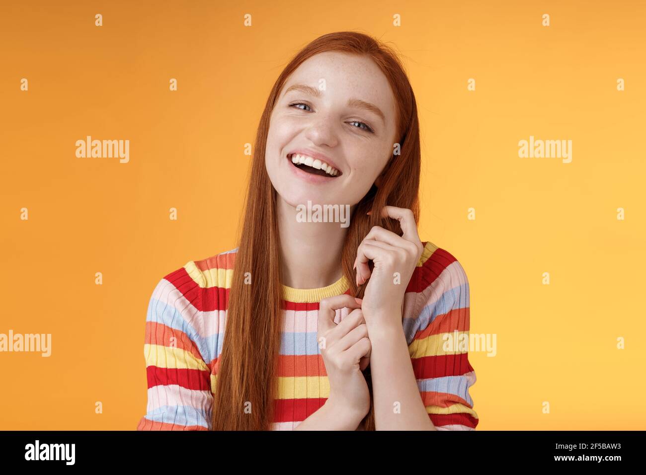 Silly good-looking flirty lively redhead young girl laughing playing ...