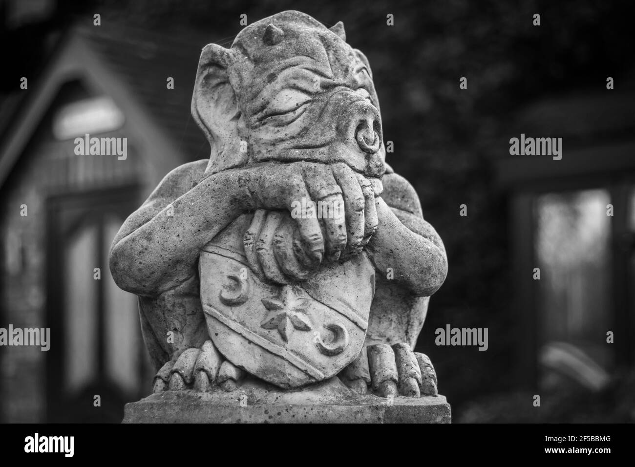Stone gargoyle asleep at its post Stock Photo - Alamy