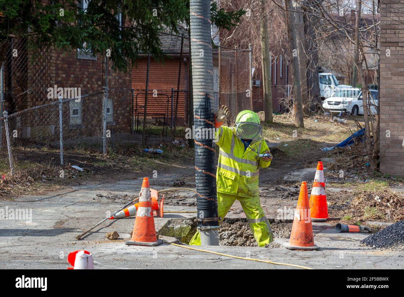 Detroit, Michigan - Workers for DTE Energy replace the original cast ...