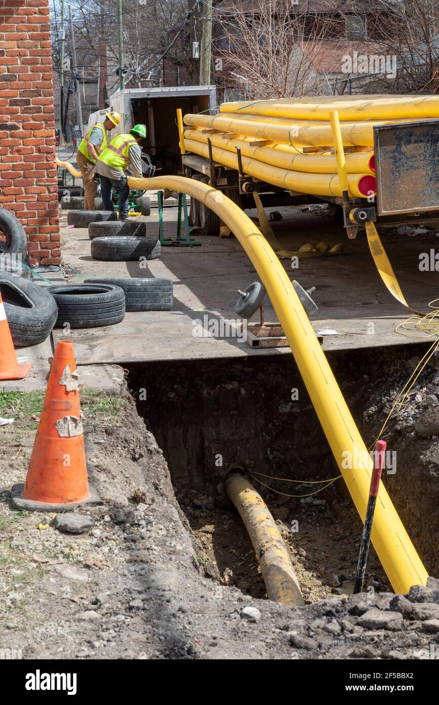 Detroit, Michigan - Workers for DTE Energy replace the original cast ...