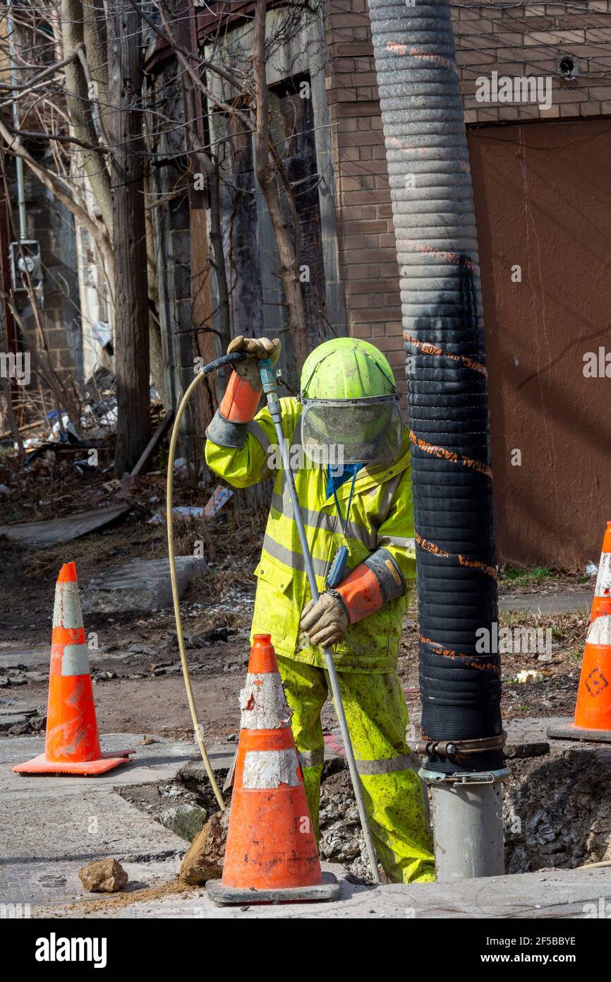 Detroit, Michigan - Workers for DTE Energy replace the original cast ...