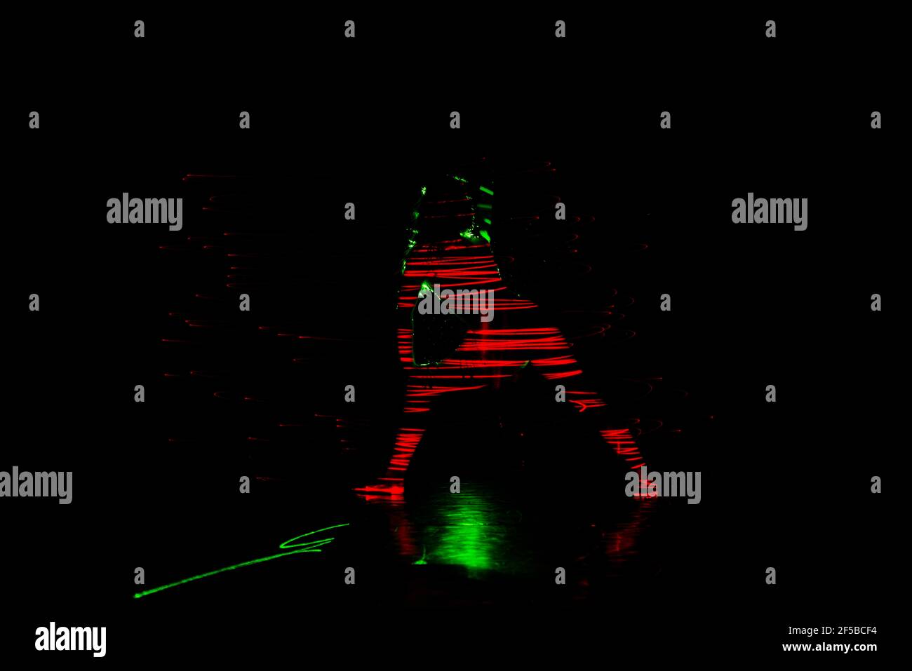 Laser show outline of a contemporary dance artist doing a dance routine ...