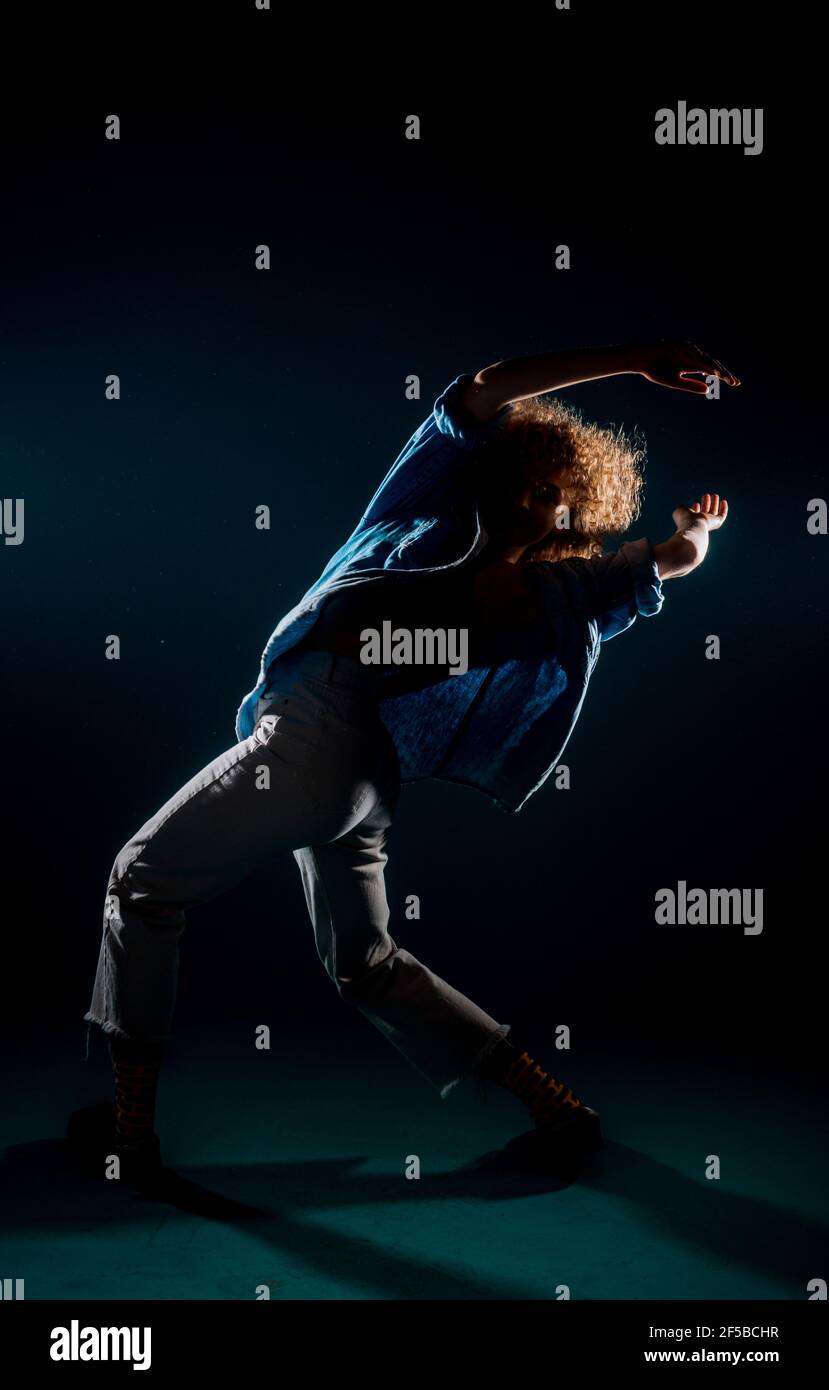 Dance moves performed by an acrobatic flexible female dancer Stock ...