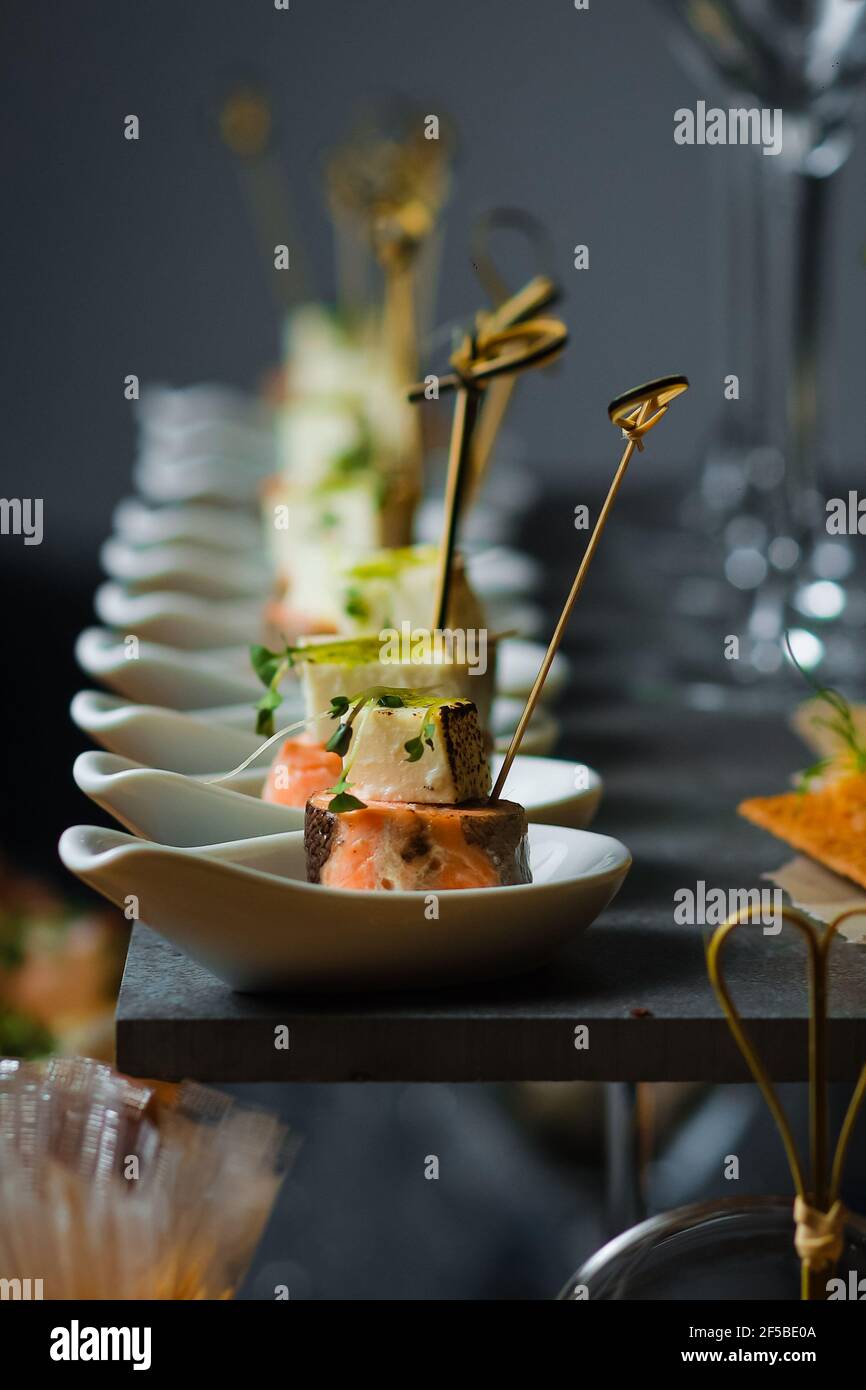 Catering service. Table with snacks food at event Stock Photo - Alamy