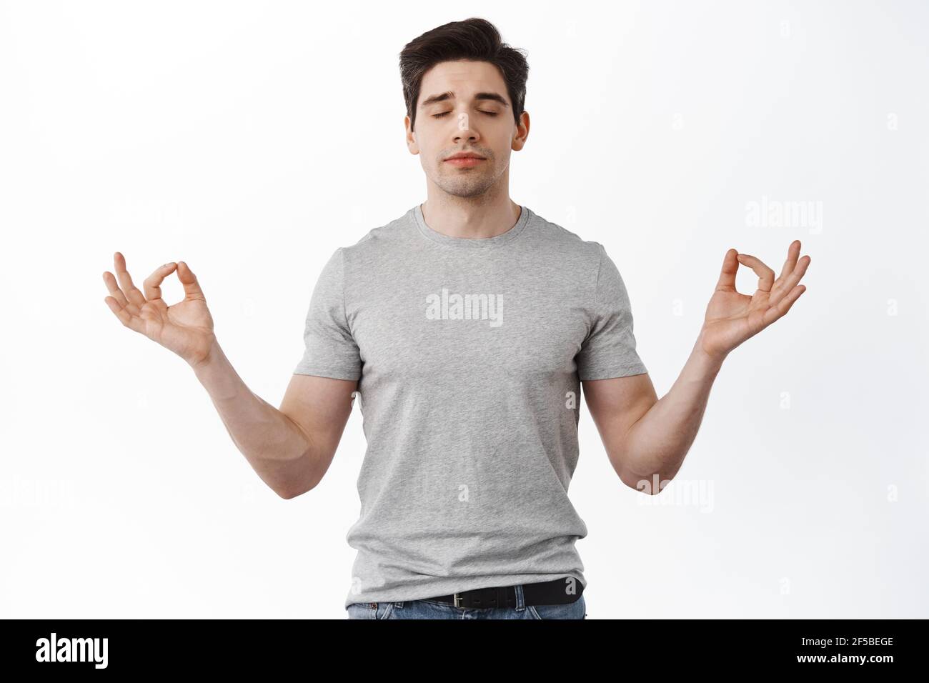 Peace inside you. Calm and relaxed man breathing, meditating with ...