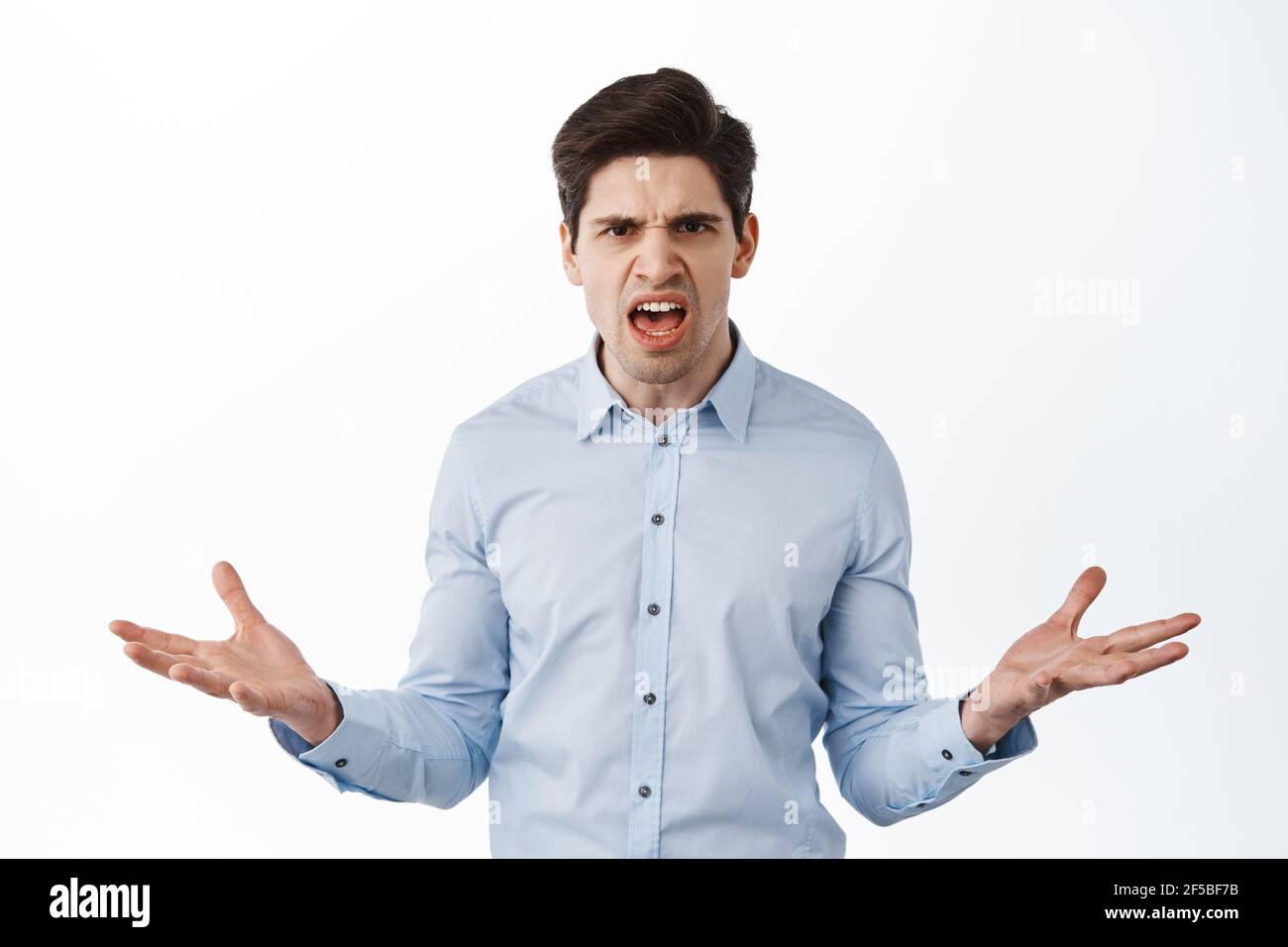 Angry and frustrated businessman, office worker complaining, look ...