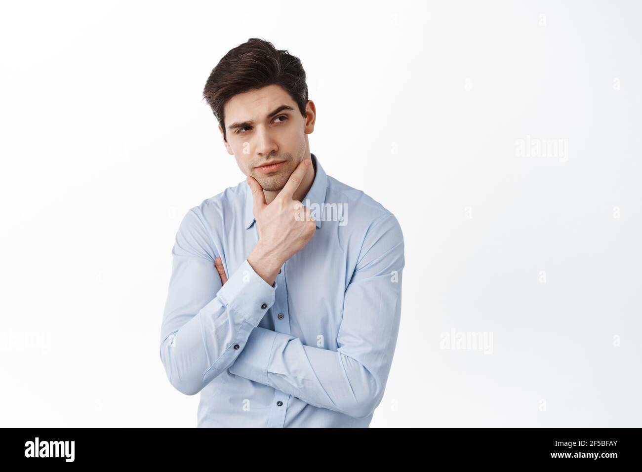 Thoughtful male entrepreneur, ceo manager thinking, looking aside at ...