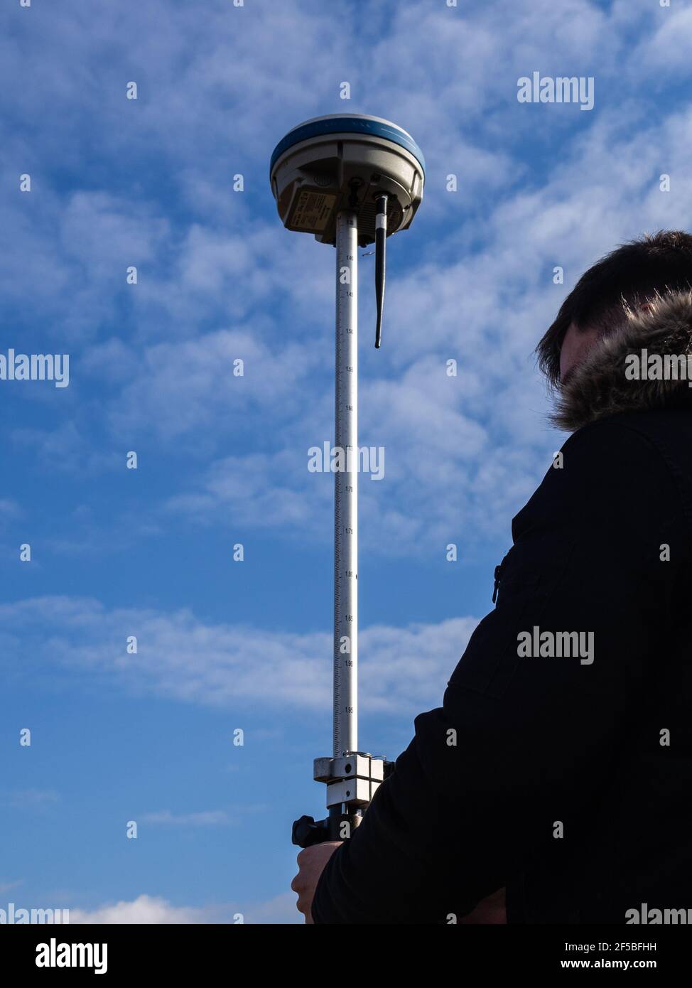 Land Surveyor measuring Stock Photo - Alamy