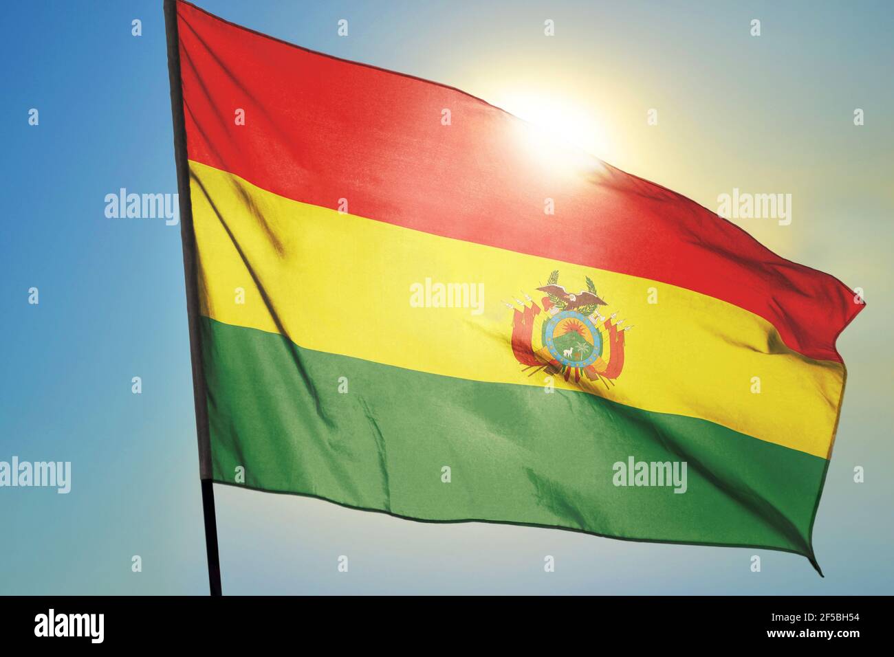 Bolivia flag waving on the wind in front of sun Stock Photo - Alamy