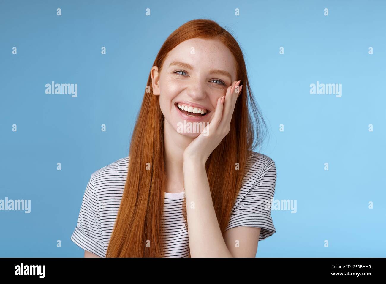 Charismatic talkative friendly-looking happy laughing redhead girl ...