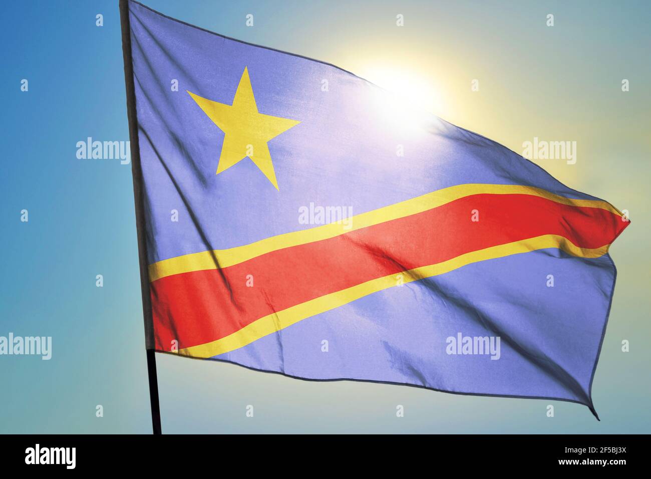 Congo flag waving on the wind in front of sun Stock Photo - Alamy