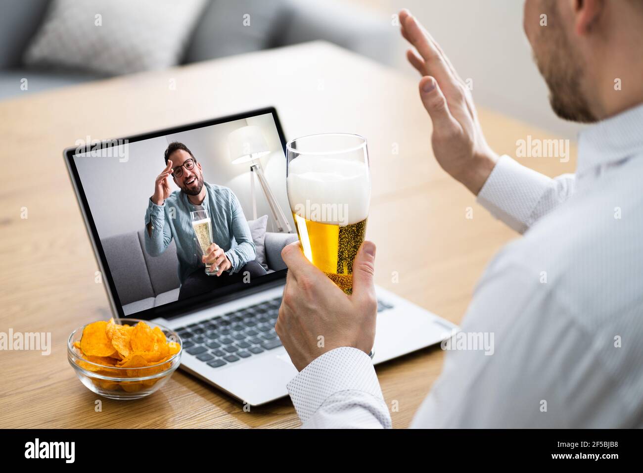 Online Virtual Beer Drinking Party On Laptop Stock Photo - Alamy
