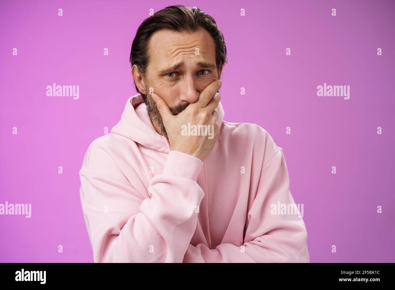 Shocked upset handsome mature bearded man hear terrible news griefing ...