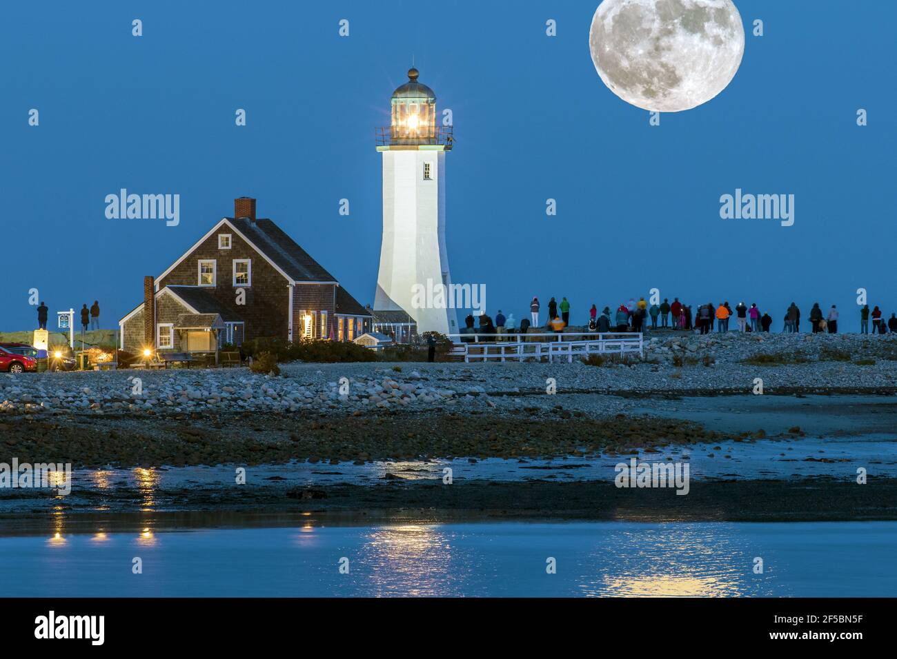 Scituate Lighthouse with crowd watching full moon, Scituate, MA USA ...