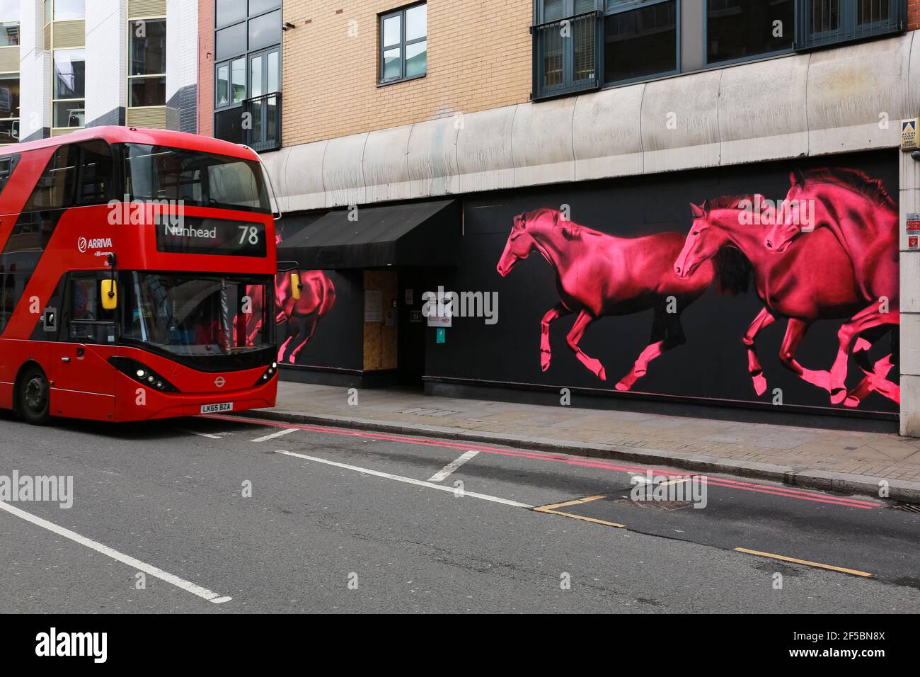 London, UK. 25 March 2021. Street Art London in Shoreditch. Neon style ...