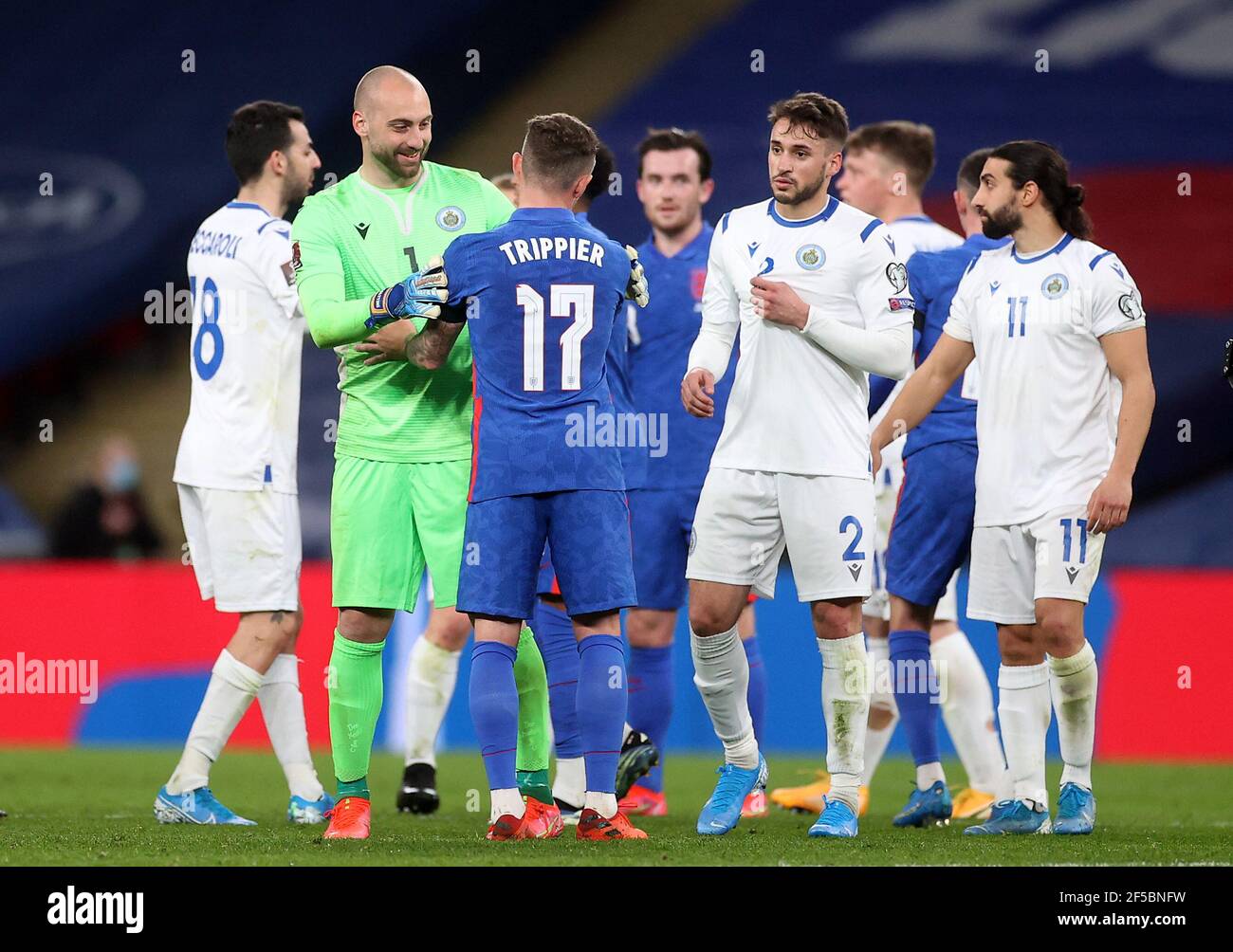 San Marino goalkeeper Elia Benedettini and England's Kieran Trippier ...