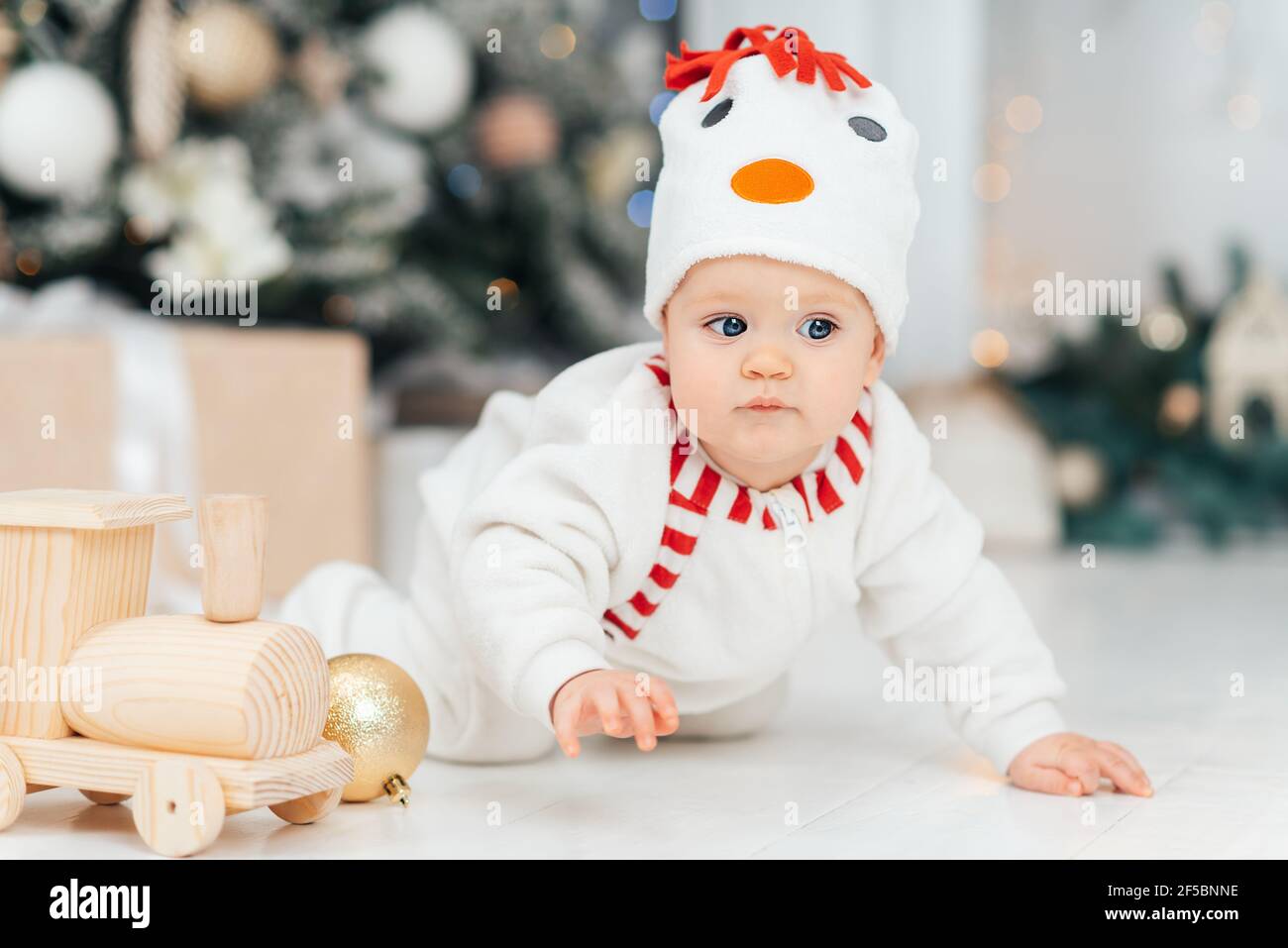 Happy Holidays, New year. Little child under Christmas tree. baby boy ...