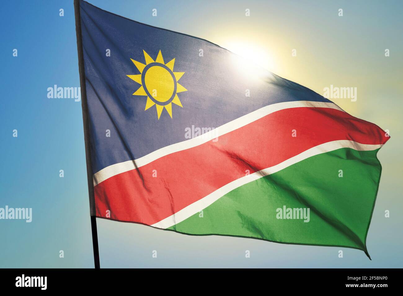 Namibia flag waving on the wind in front of sun Stock Photo - Alamy
